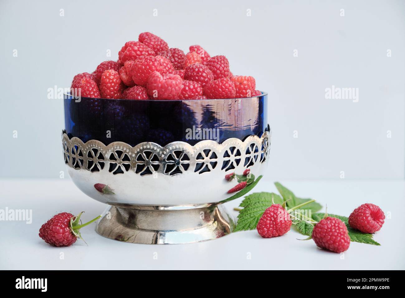 Fresh organic raspberries in a Vintage Glass Bowl with Metal Stand. Red ...