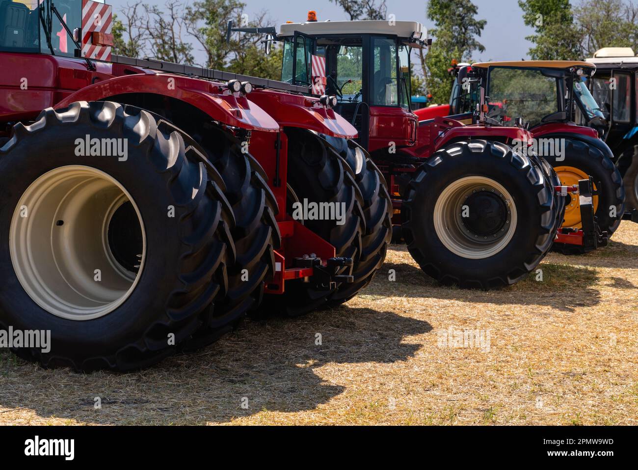 Agricultural tractors on a field. High quality photo Stock Photo - Alamy