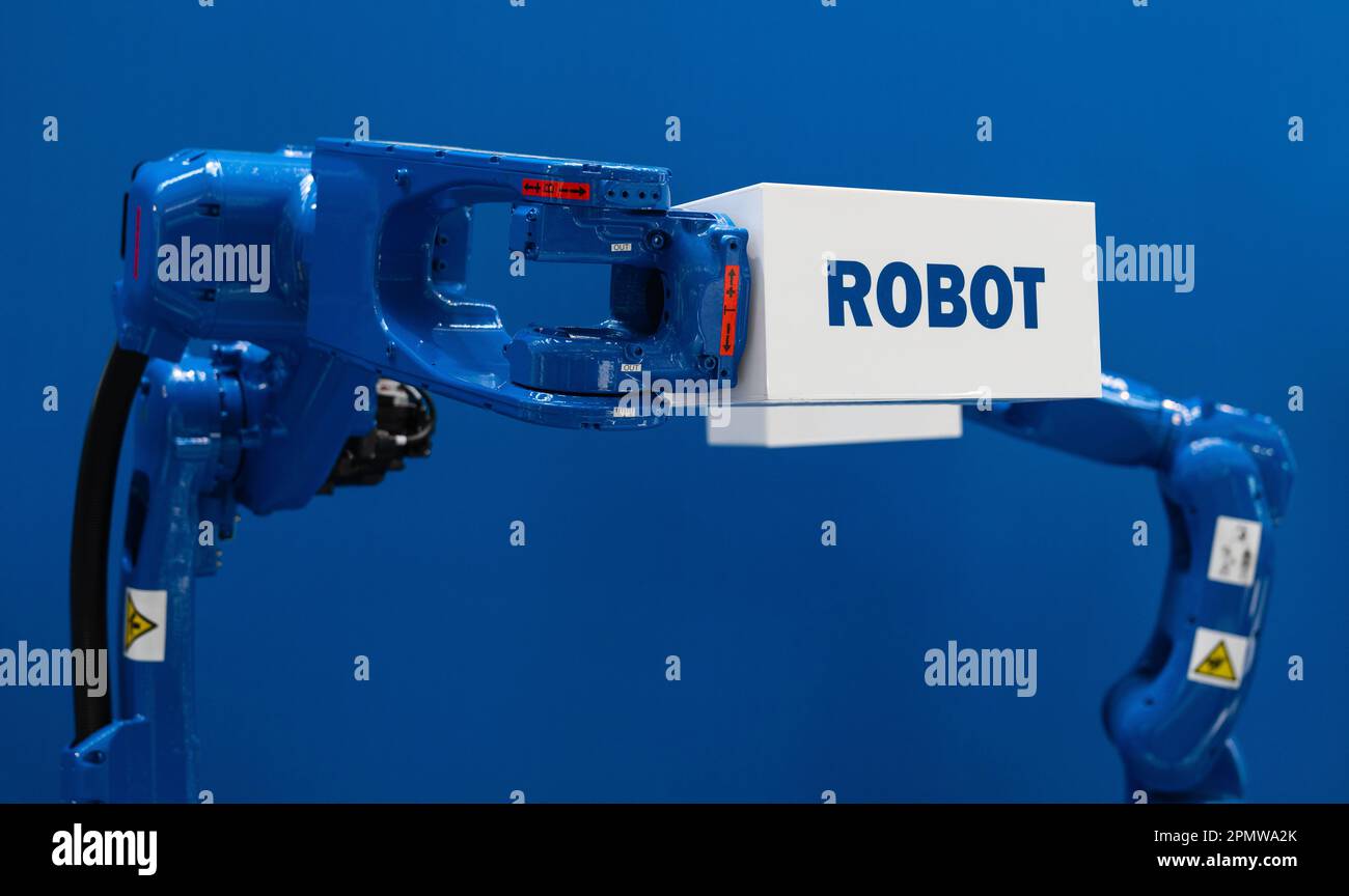 Robot arm with box and text ROBOT. Smart industry concept. High quality ...