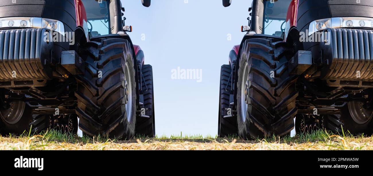 Agricultural tractors on a field. High quality photo Stock Photo - Alamy