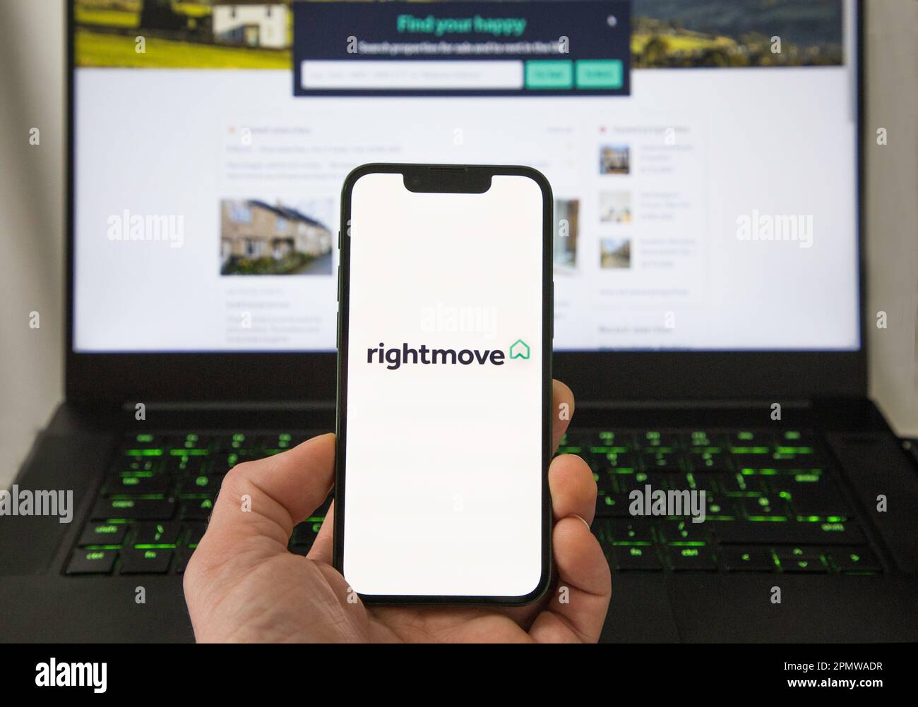 Right move Mobile app in front of the Right Move website Stock Photo ...