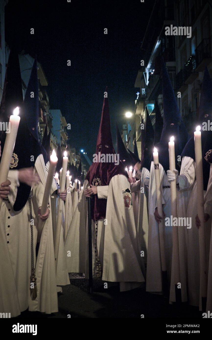 Penitents of the Virgen de la Macarena in the Holy Week procession ...