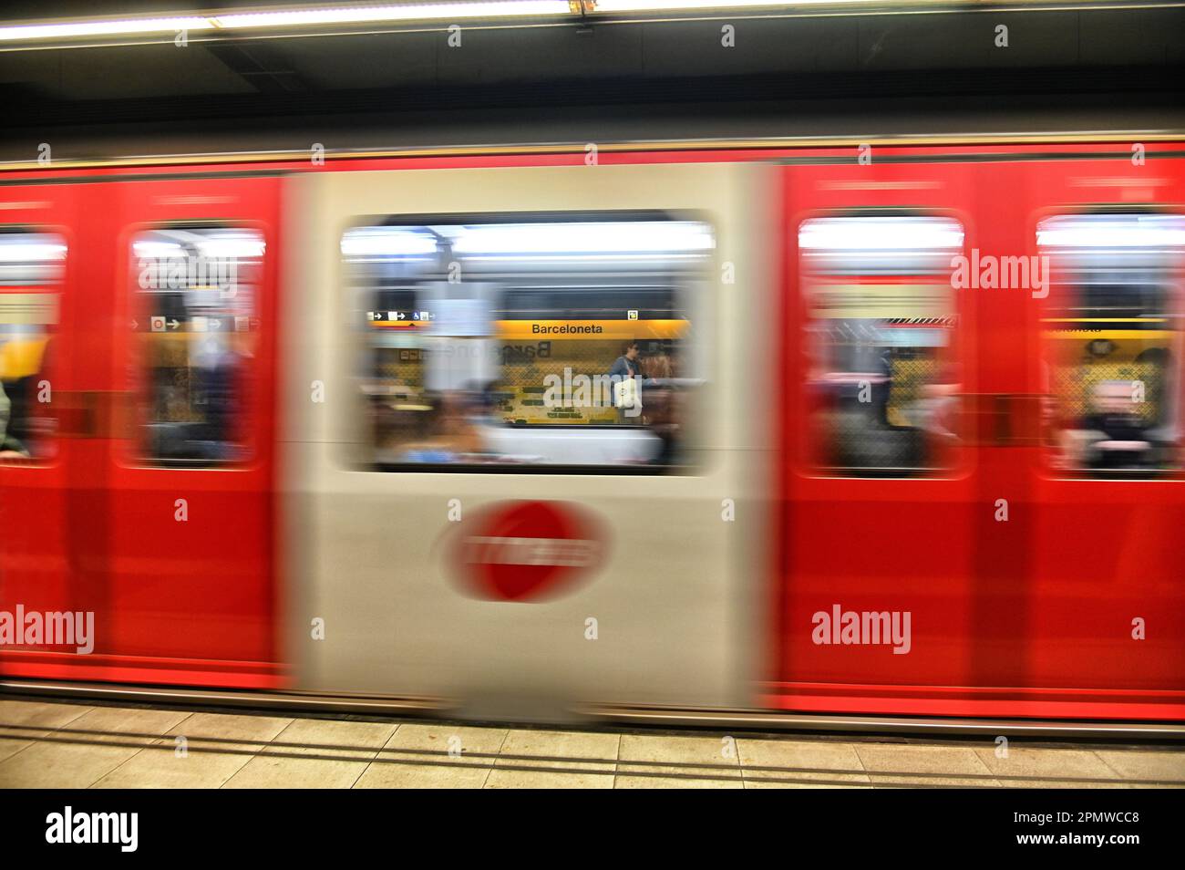 A red white subway train moving from the Barceloneta station in ...