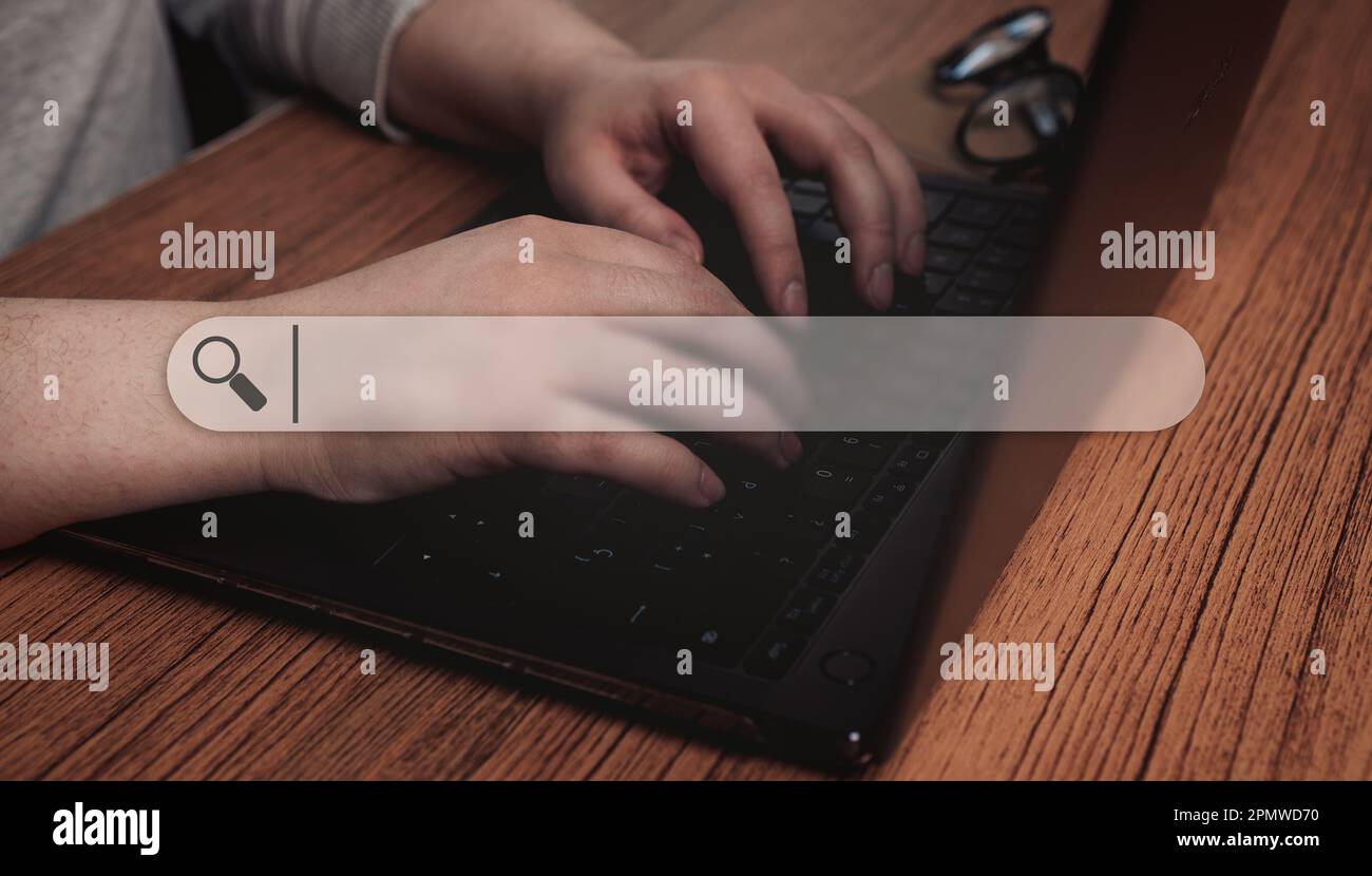 Woman using laptop with holographic search bar. Search Engine ...