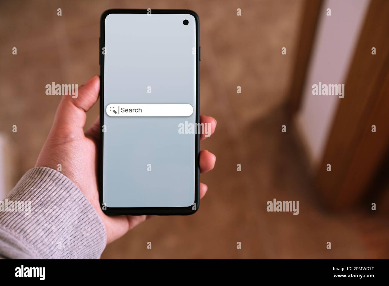 Woman using smartphone with search bar on screen. Search Engine ...