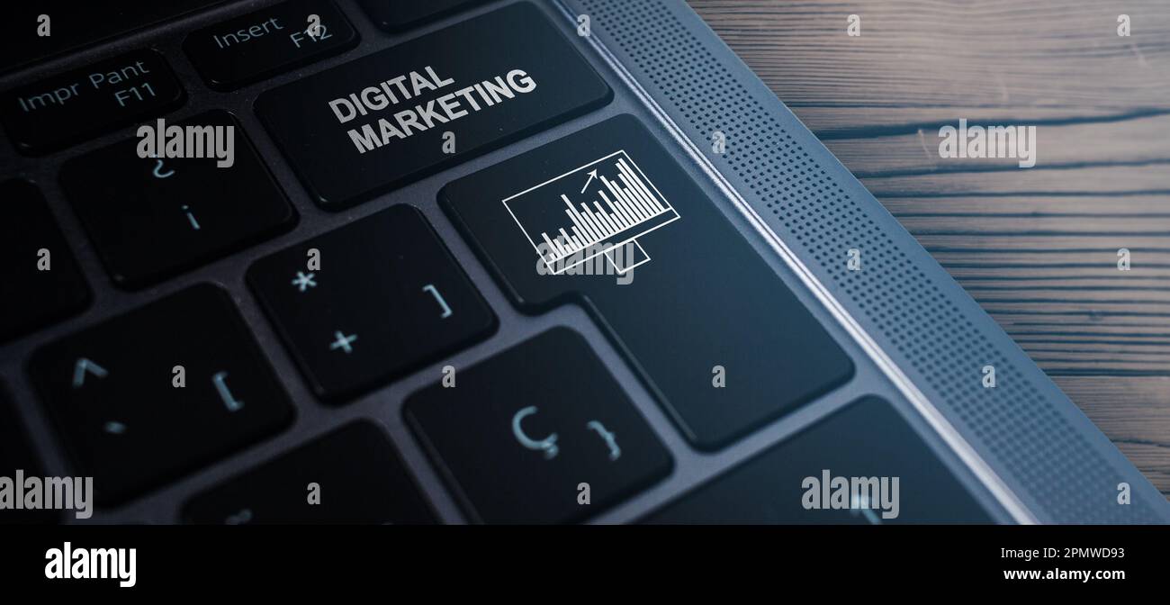 Laptop keyboard with the words "Digital Marketing" on button. Digital ...