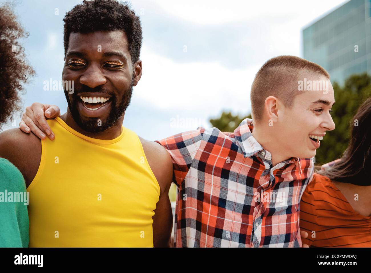 Diverse people celebrating together outdoor at pride event - Focus on ...