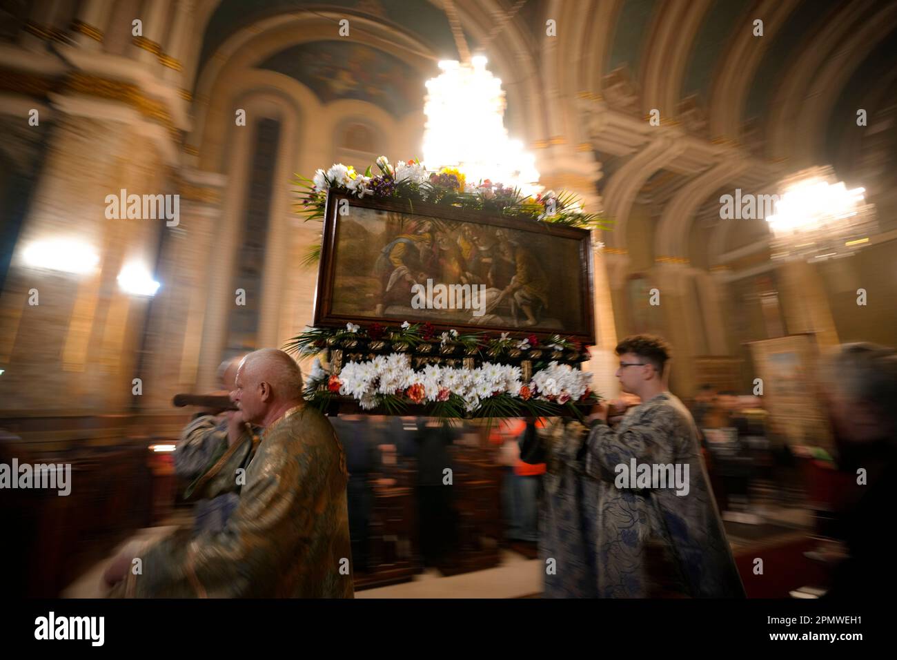 People carry a wooden structure depicting the coffin of Jesus Christ ...