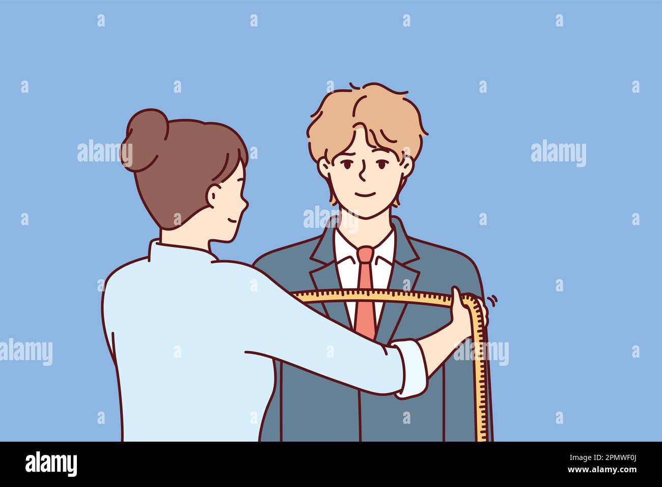 Woman tailor measures shoulders of man in centimeters to make formal ...