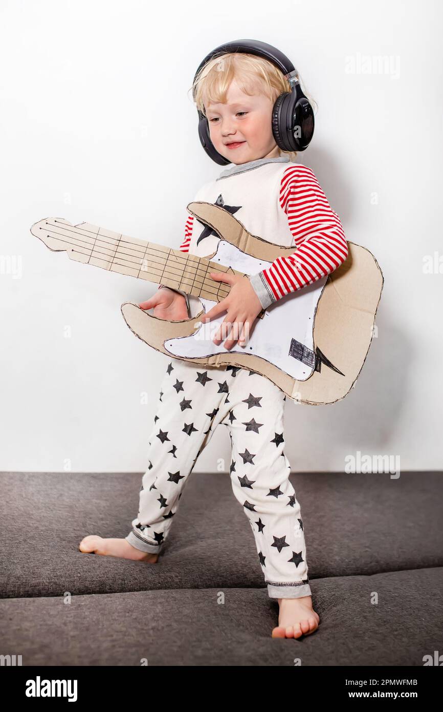 Child playing musical instrument funny hi-res stock photography and ...