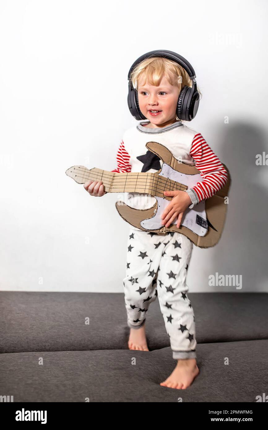 happy singer with guitar. little funny girl with DIY guitar. musical ...