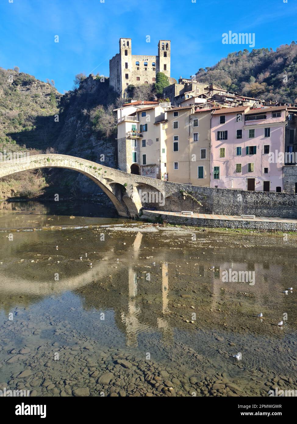 A captivating vertical shot of Dolceacqua, an Italian medieval village ...