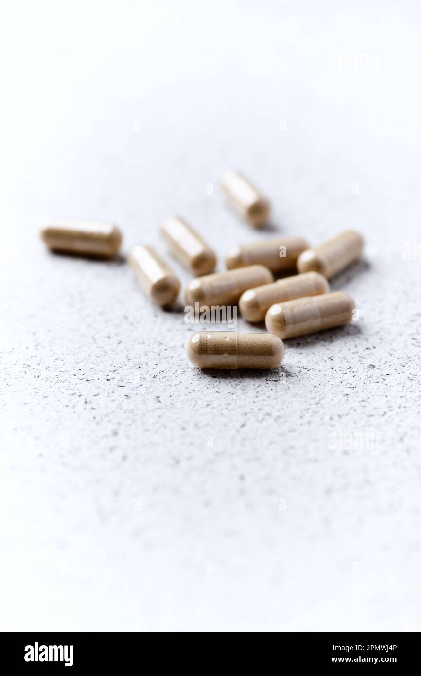 Ashwagandha (Withania somnifera) capsules. Bright paper background ...