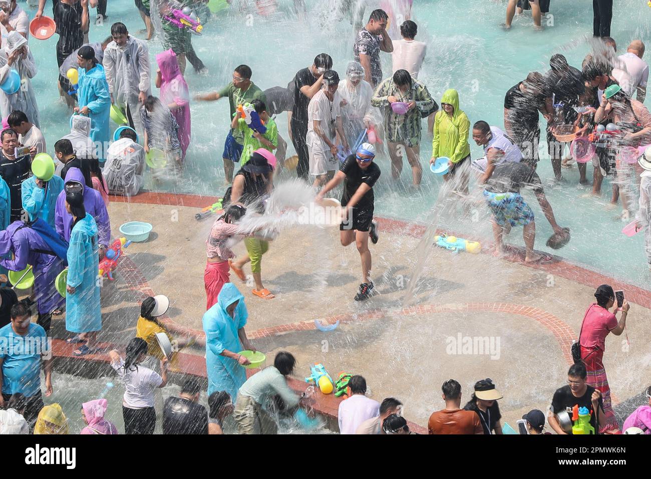 Jinghong, China's Yunnan Province. 15th Apr, 2023. People splash water ...