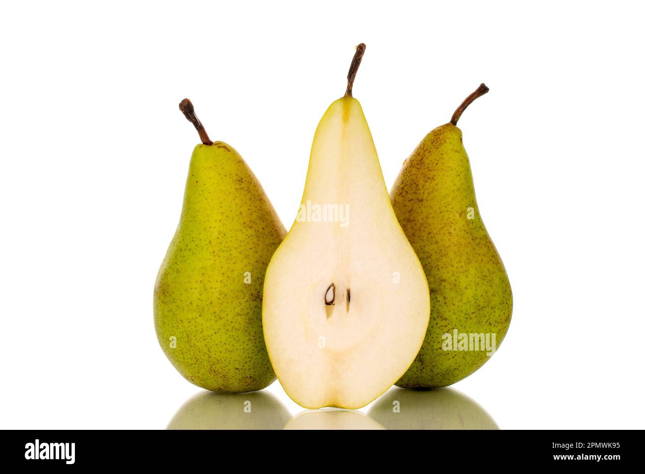 Two whole and one half ripe organic pears, macro, on a white background ...