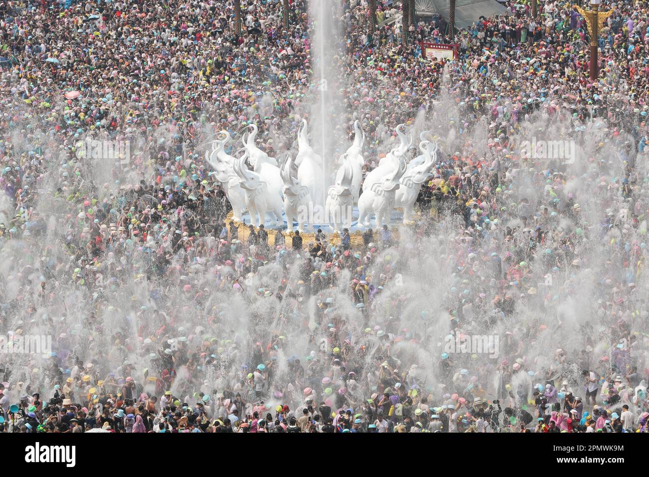 Jinghong, China's Yunnan Province. 15th Apr, 2023. People splash water ...