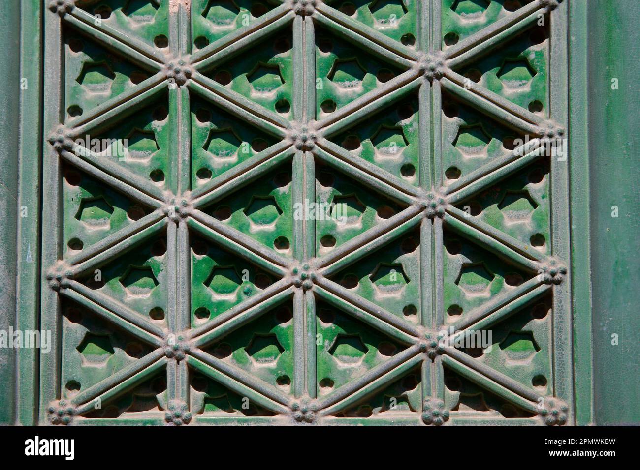 The blue glazed tiles on the wall as the background, the traditional ...