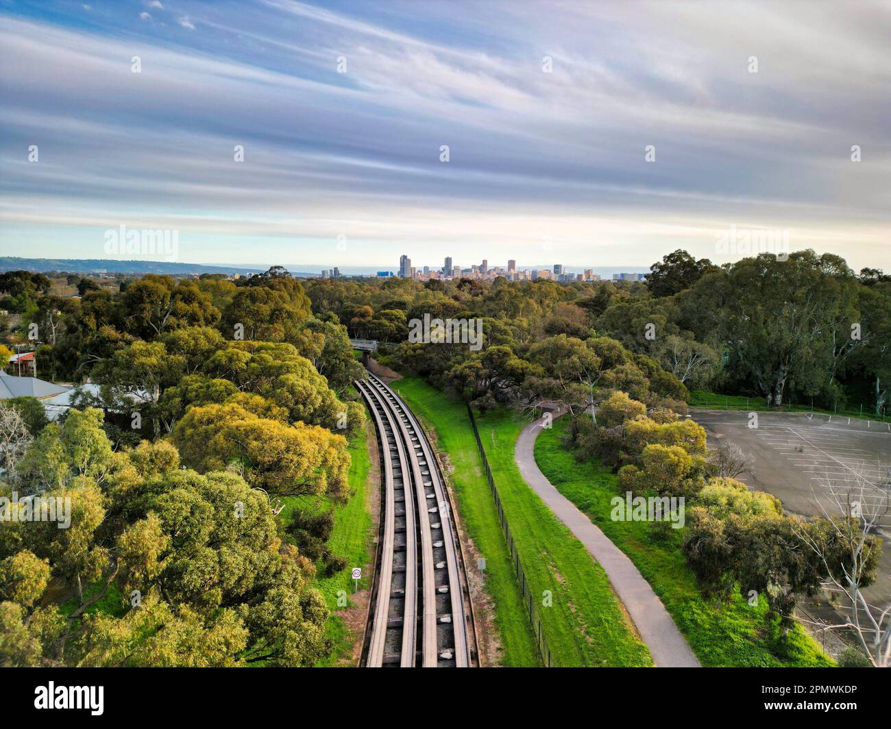 An aerial view of O-Bahn tracks surrounded by lush greenery ...
