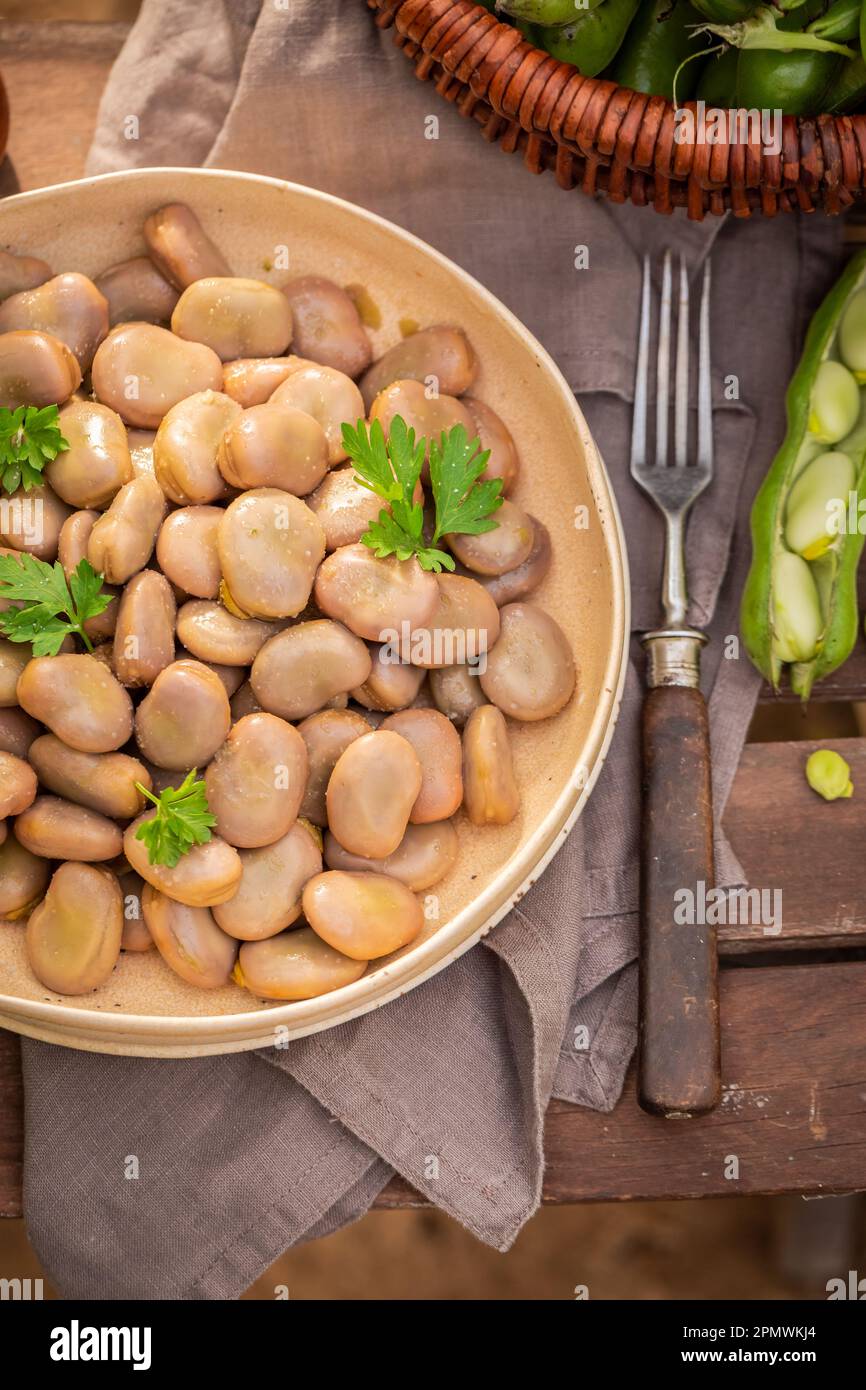 Fresh boiled broad beans served in garden. Perfect summer snack. Broad ...