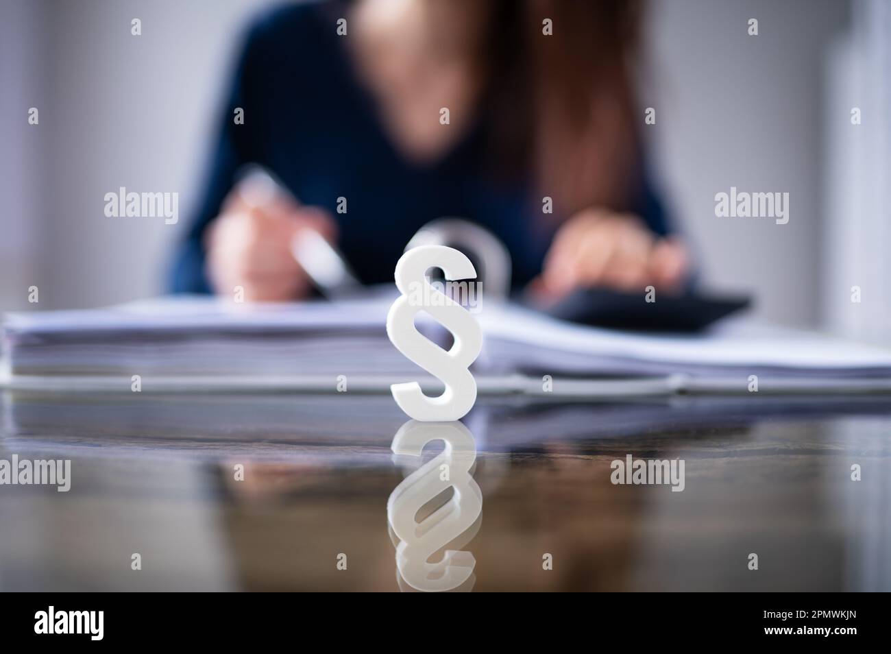 Close-up Of A Red Paragraph Symbol In Front Of Person Working At ...