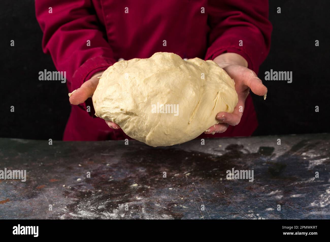 Professional cook makes yeast dough. Chef prepares yeast dough for ...