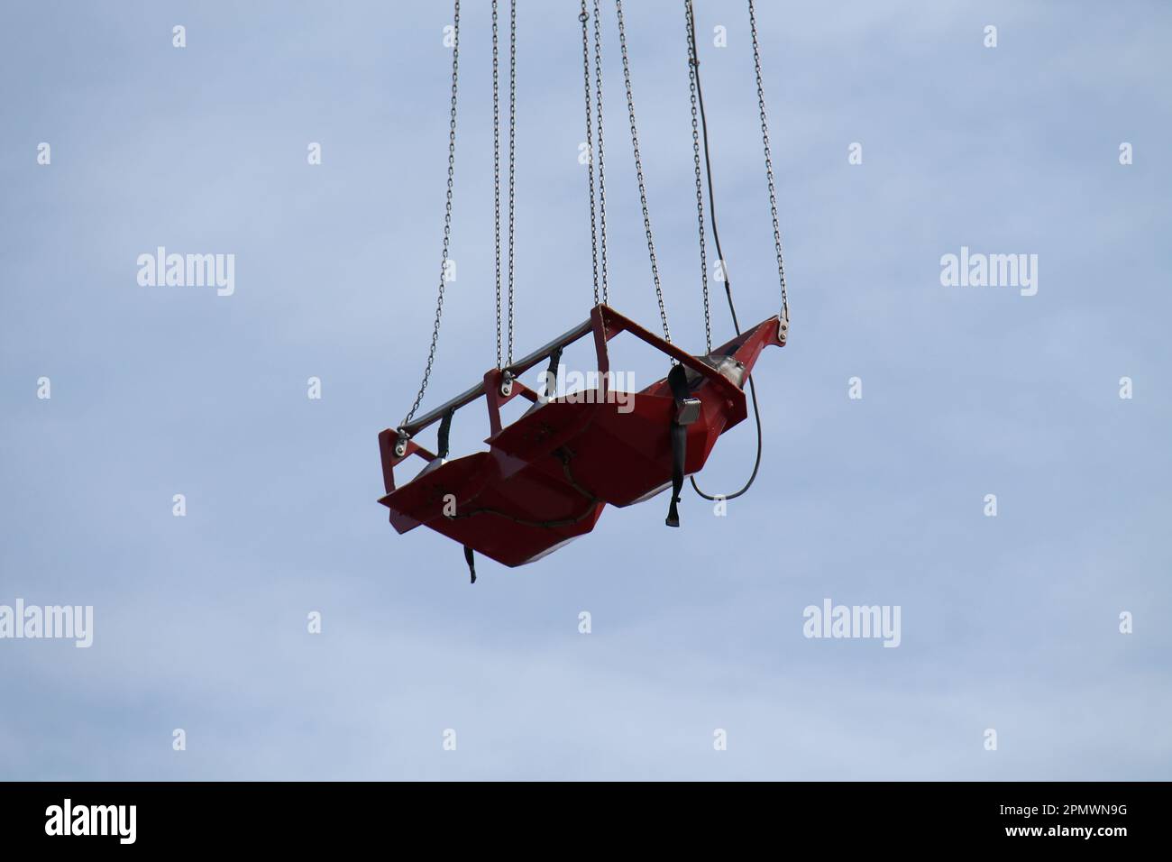 The Hanging Swing Seats of a High Fun Fair Ride Stock Photo - Alamy