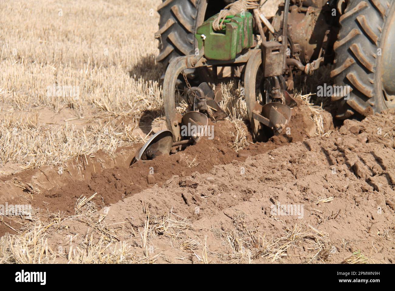 A Small Vintage Plough on an Agricultural Tractor Stock Photo - Alamy