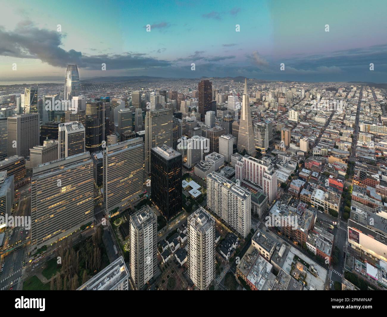 A stunning aerial view of a bustling city skyline, featuring tall high-rise buildings in the ...
