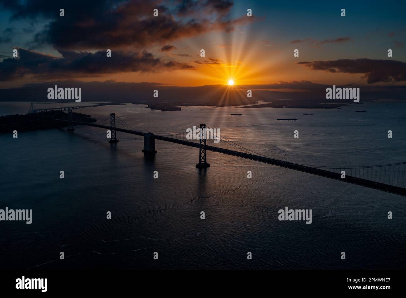 A stunning sunset view of a bridge spanning over an ocean horizon Stock ...