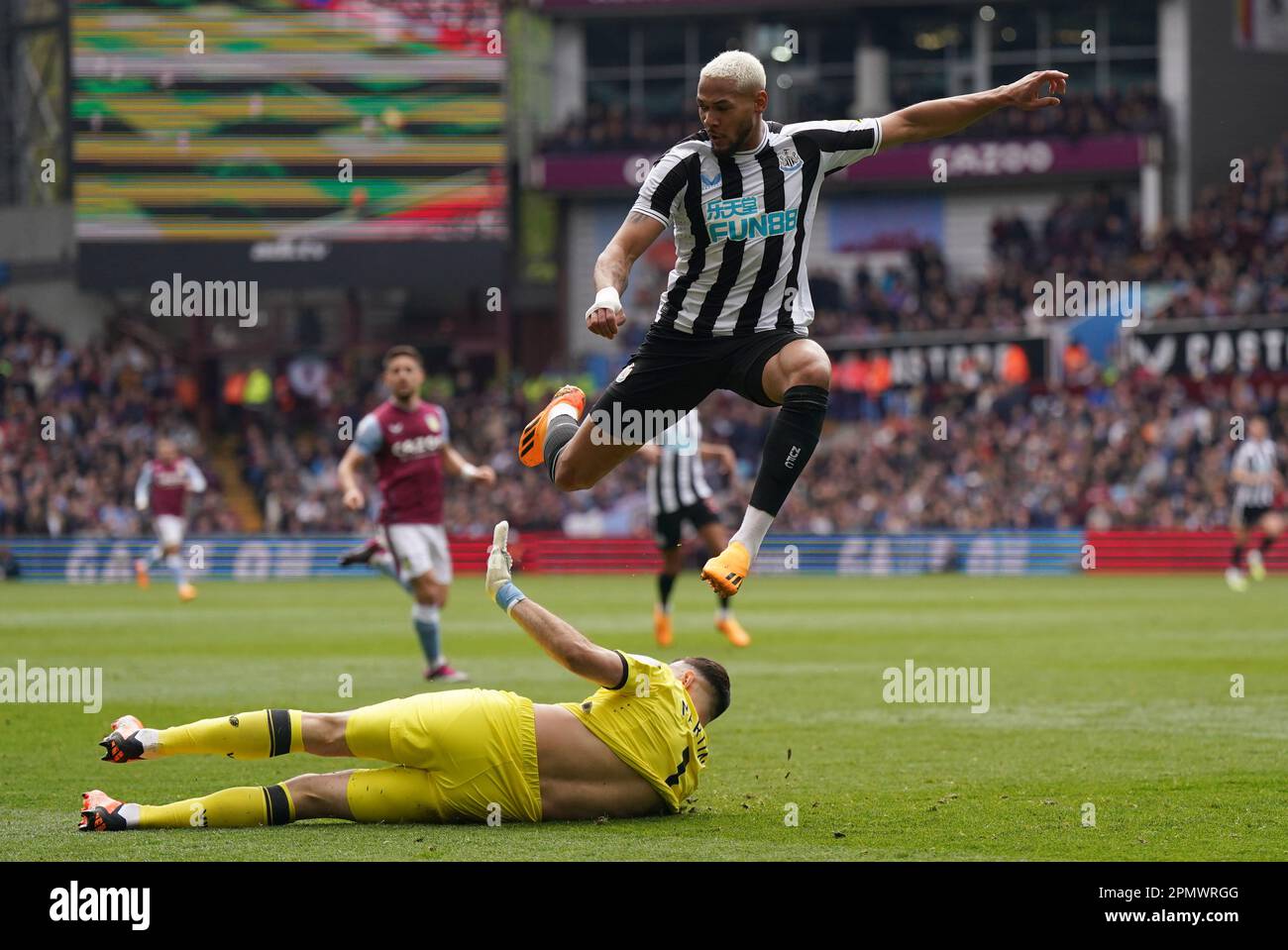 Aston Villa goalkeeper Emiliano Martinez makes a save at the feet of ...