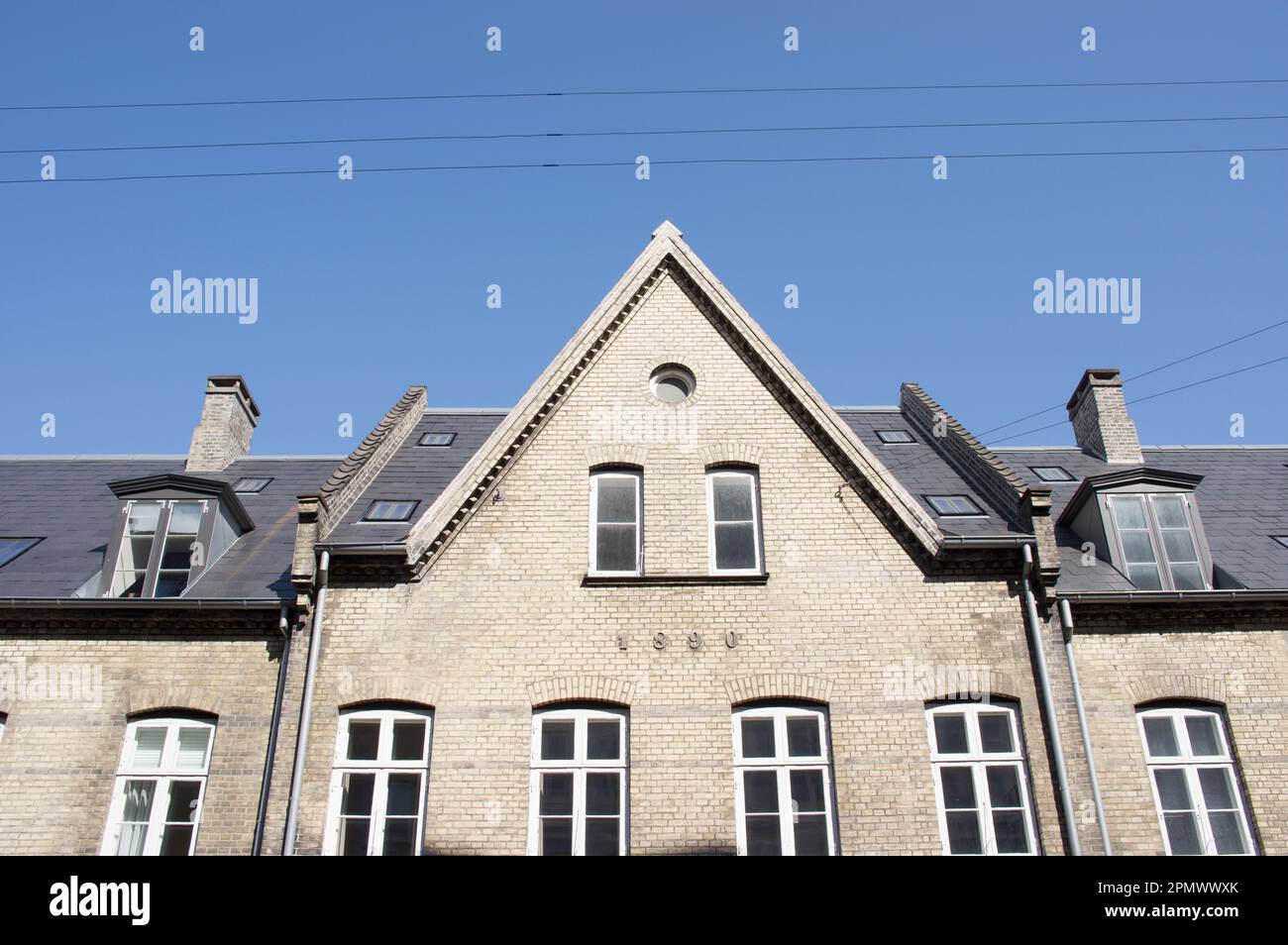 Facade and roof of a historic terraced house with dormer with a clear ...
