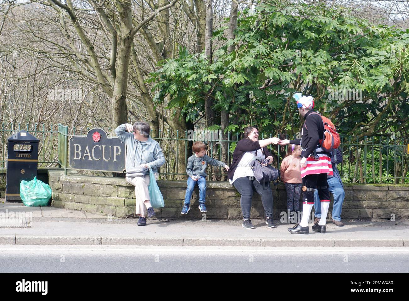 Member of Britannia Coconutters selling souvenirs to spectators during the annual perambulation ...