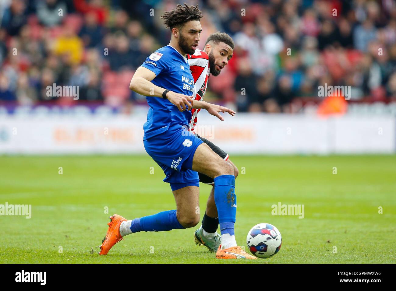 Jayden Bogle #20 of Sheffield United and Kion Etete #9 of Cardiff City ...