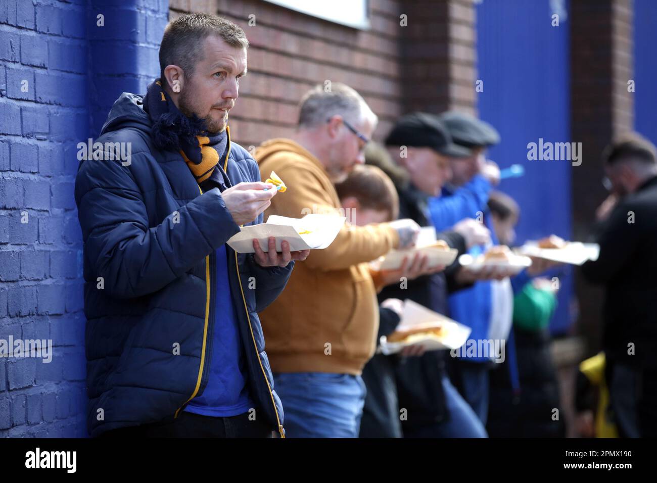 Fans eating fish & chips outside the stadium ahead of the Premier ...