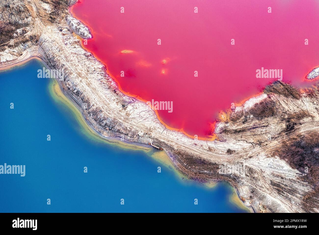 vast titanium mine with tailing ponds filled with technical fluids used ...