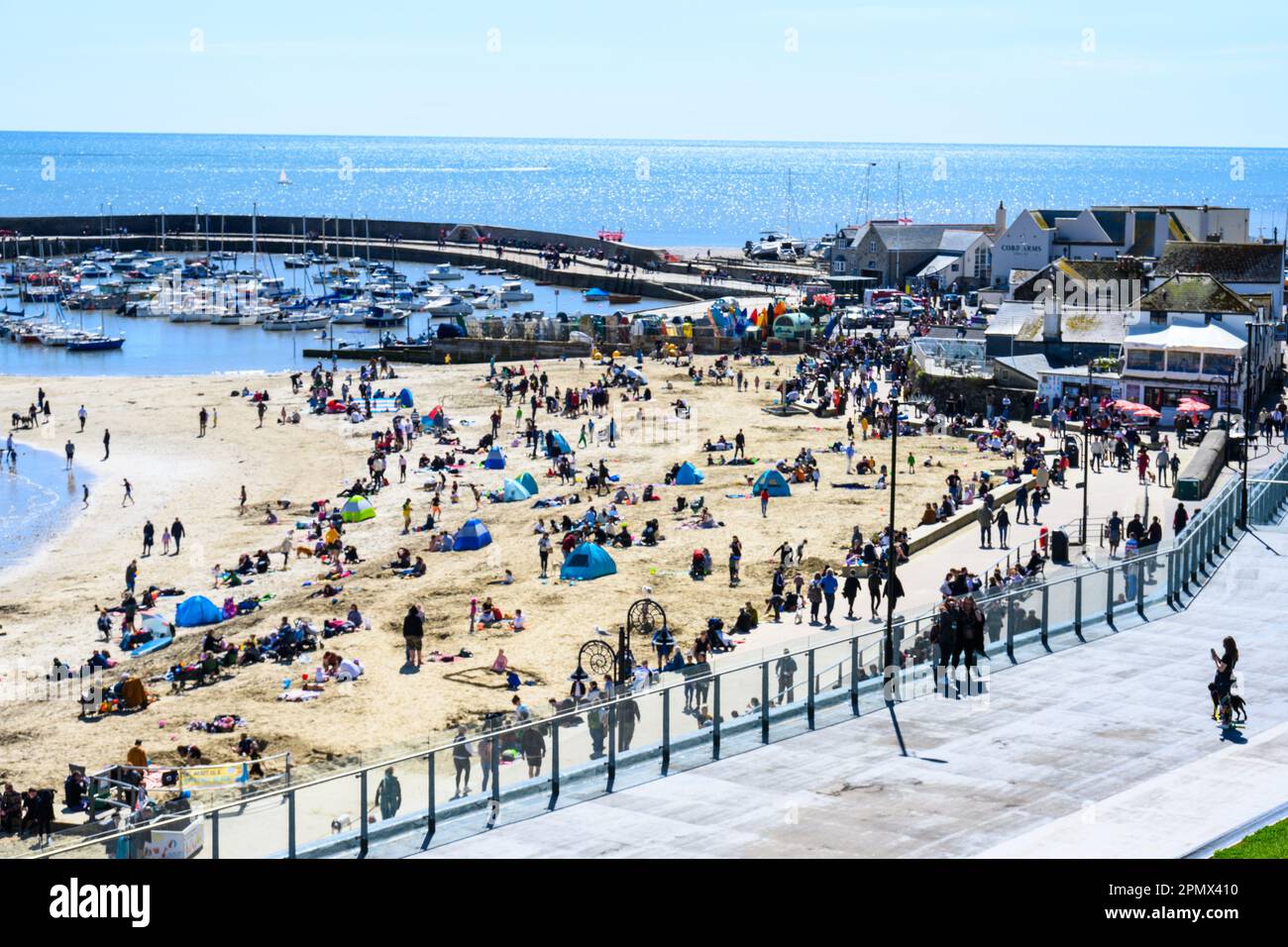 Lyme Regis, Dorset, UK. 15th Apr, 2023. UK Weather: Beachgoers and ...