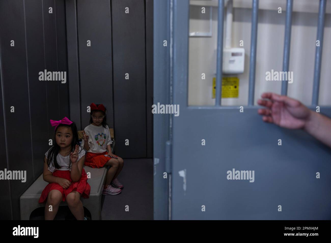 Children visit a mock confinment prison cell at the Hong Kong ...