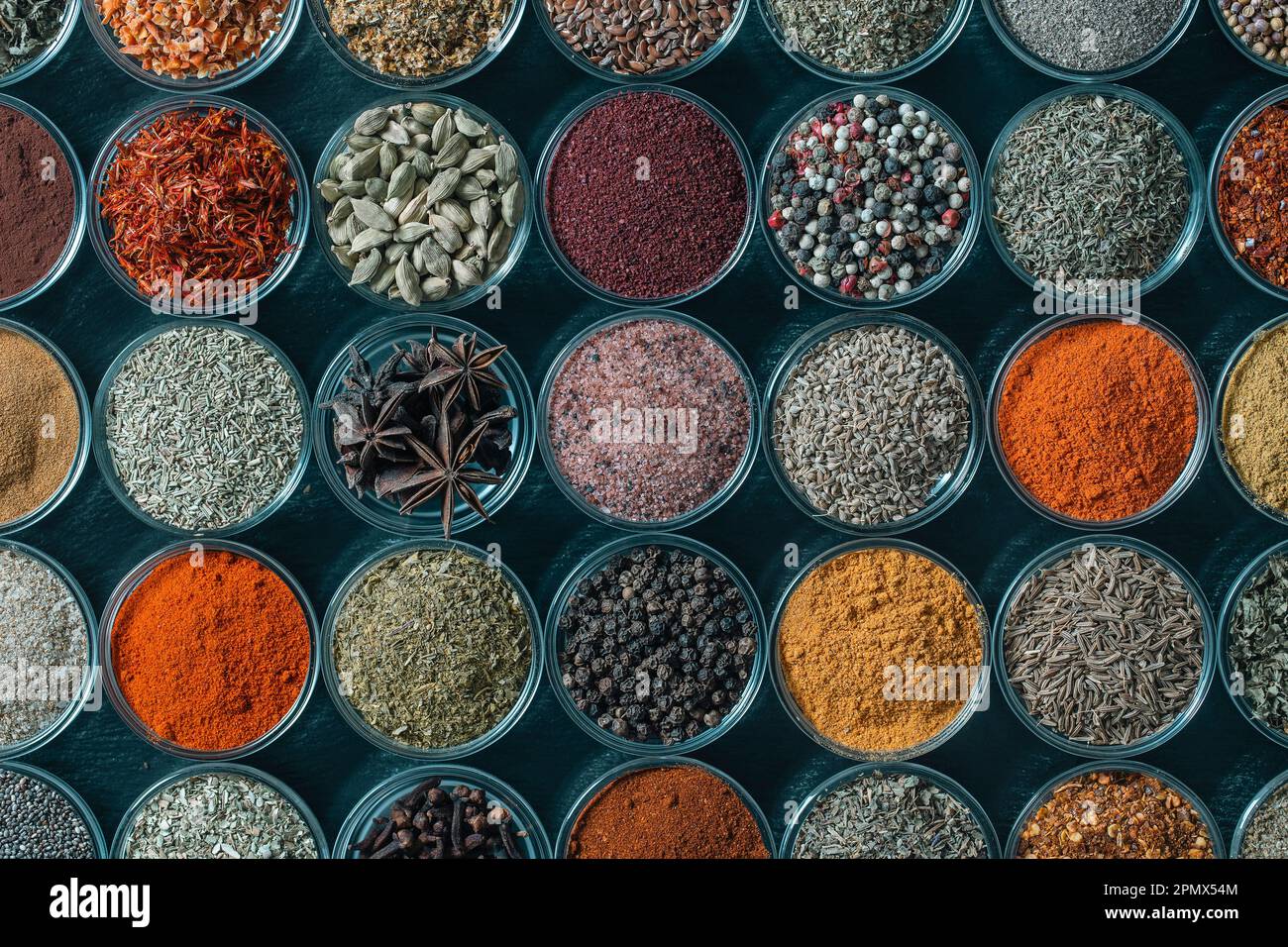 Assortment of aromatic spices, seeds and dry herbs for cooking food on ...