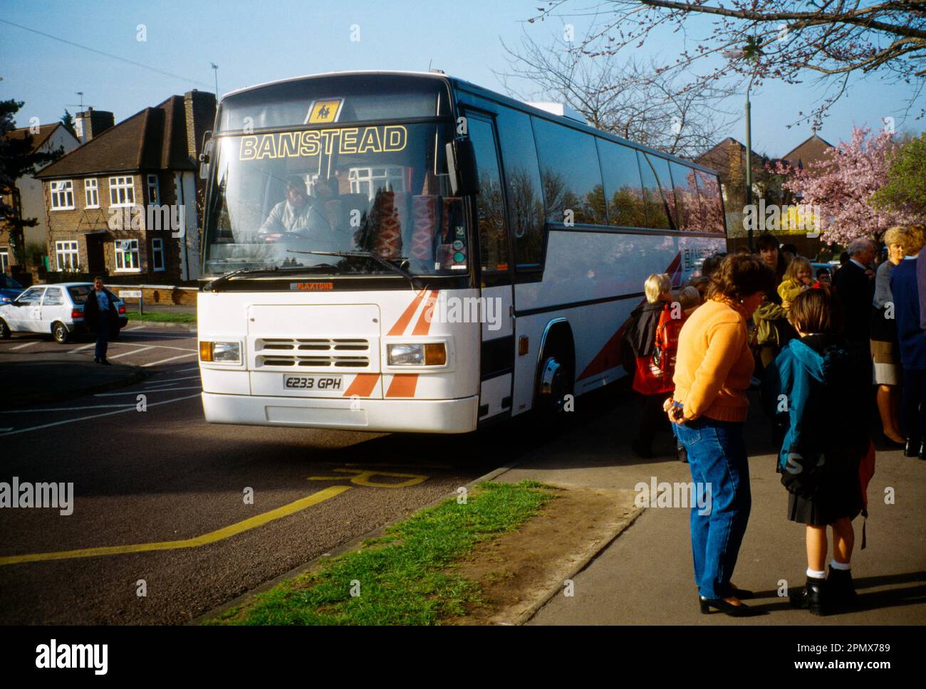 Children Boarding School Bus for School Trip at Springtime Stock Photo ...