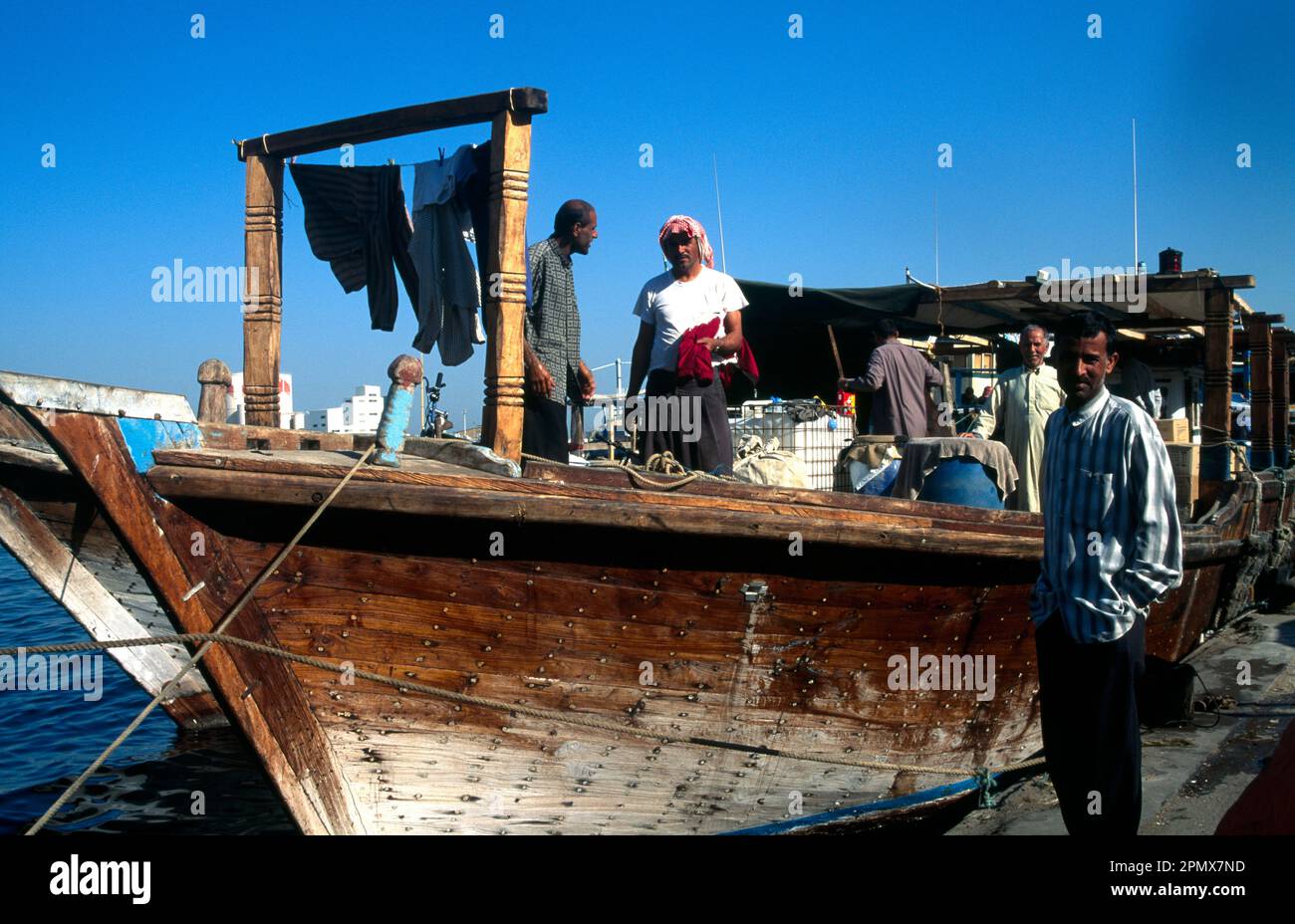 Sharjah UAE Creek with Dhow and Crew Clothes Hanging up to Dry Stock ...