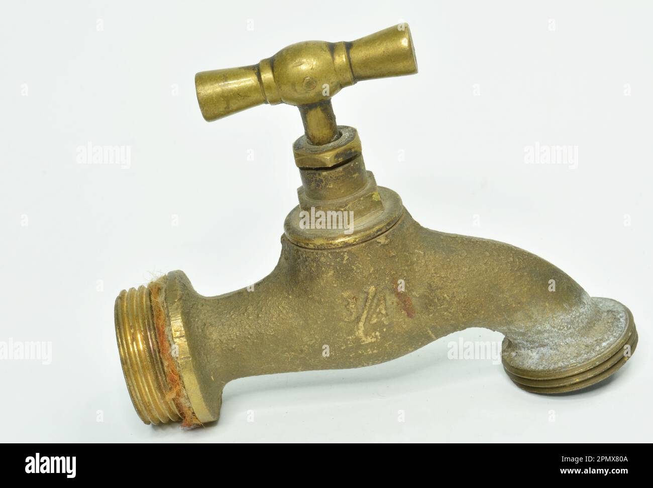 Retro three quarters of an inch water tap isolated on white background ...