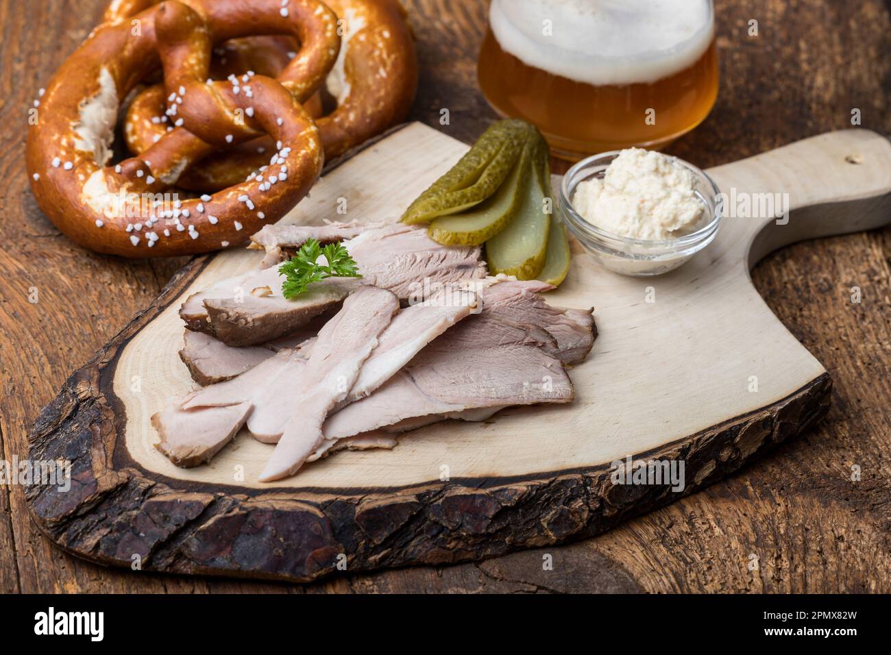 sliced bavarian roasted pork with beer Stock Photo - Alamy