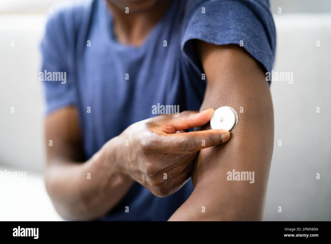 Close-up Of A Man Testing Glucose Level With A Continuous Glucose ...