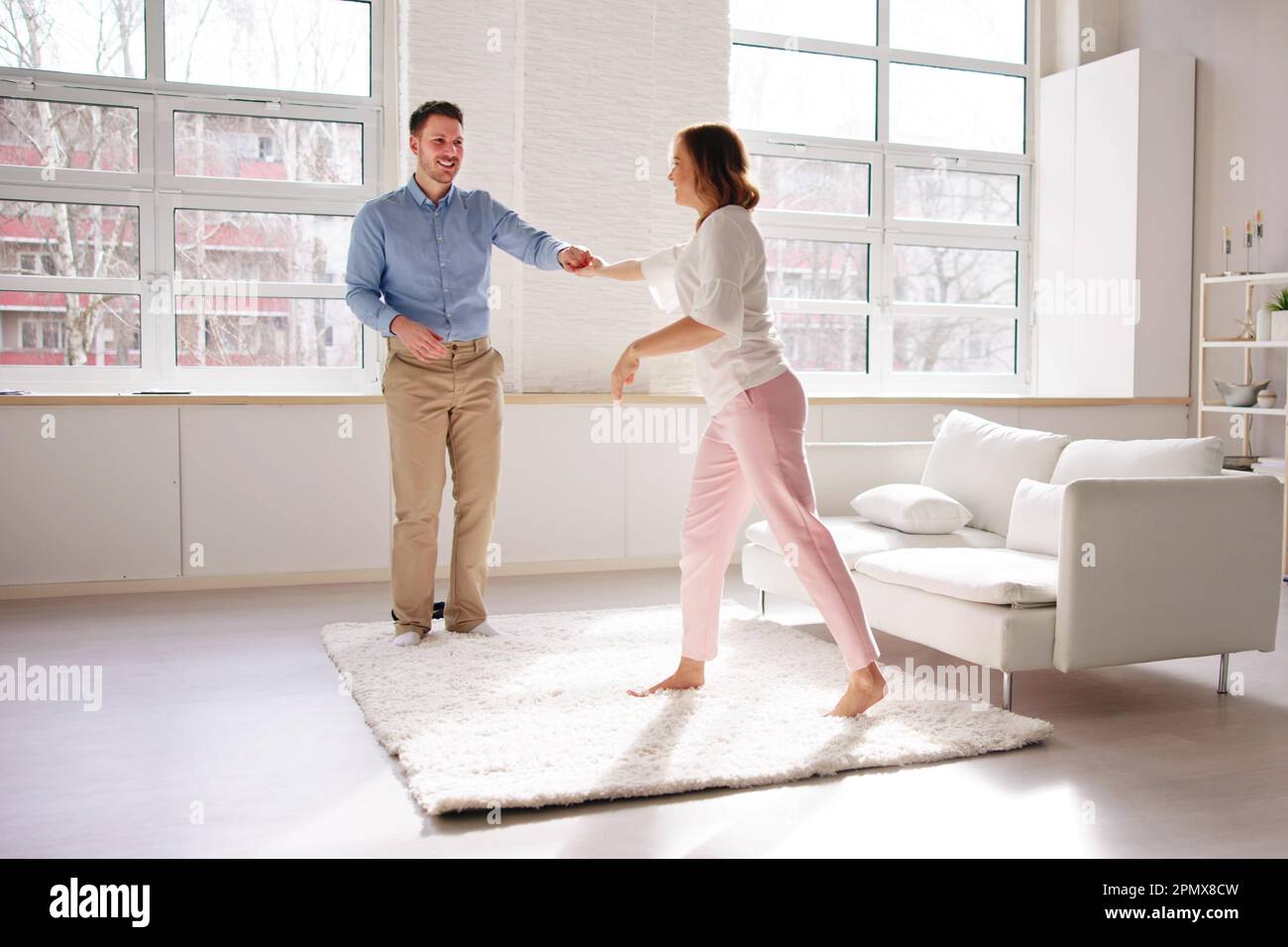 Excited Family Couple Dancing. People Dance At Home Stock Photo - Alamy