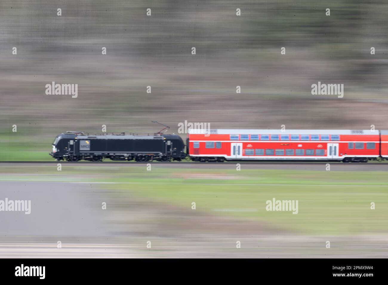 13 April 2023, Hesse, Bad Soden-Salmünster: A regional train is running ...