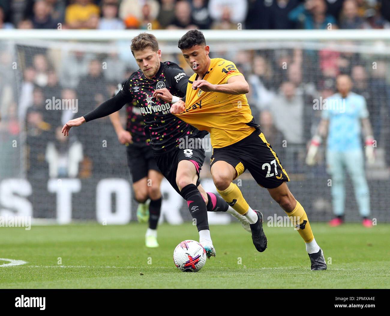 Brentford's Mathias Jensen (left) and Wolverhampton Wanderers' Matheus ...