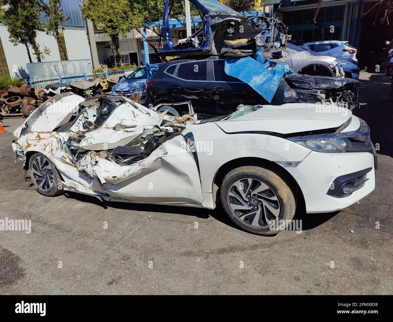Scrapped cars and vehicles in the ruined city after earthquake, tsunami ...