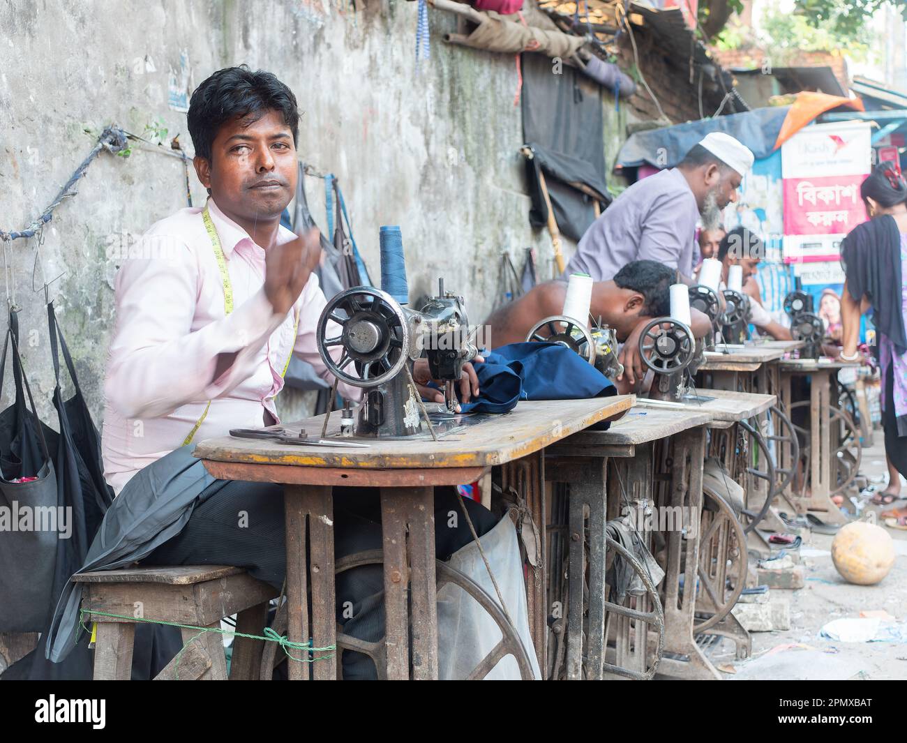 Tailors working at a street in Dhaka, Bangladesh Stock Photo - Alamy