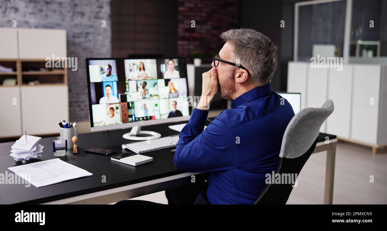 Bored Employee In Video Conference Training Meeting Stock Photo - Alamy