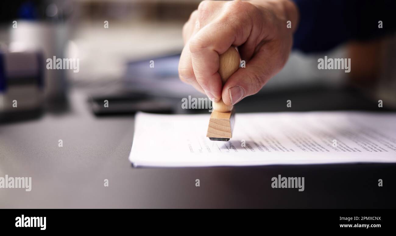 Approved Notary Stamp Rubber Stamp. Hand Pressing Stock Photo - Alamy